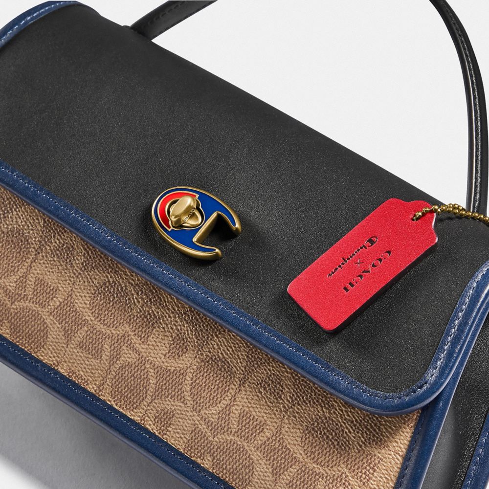 COACH® | Coach X Champion Turnlock Clutch In Signature Canvas