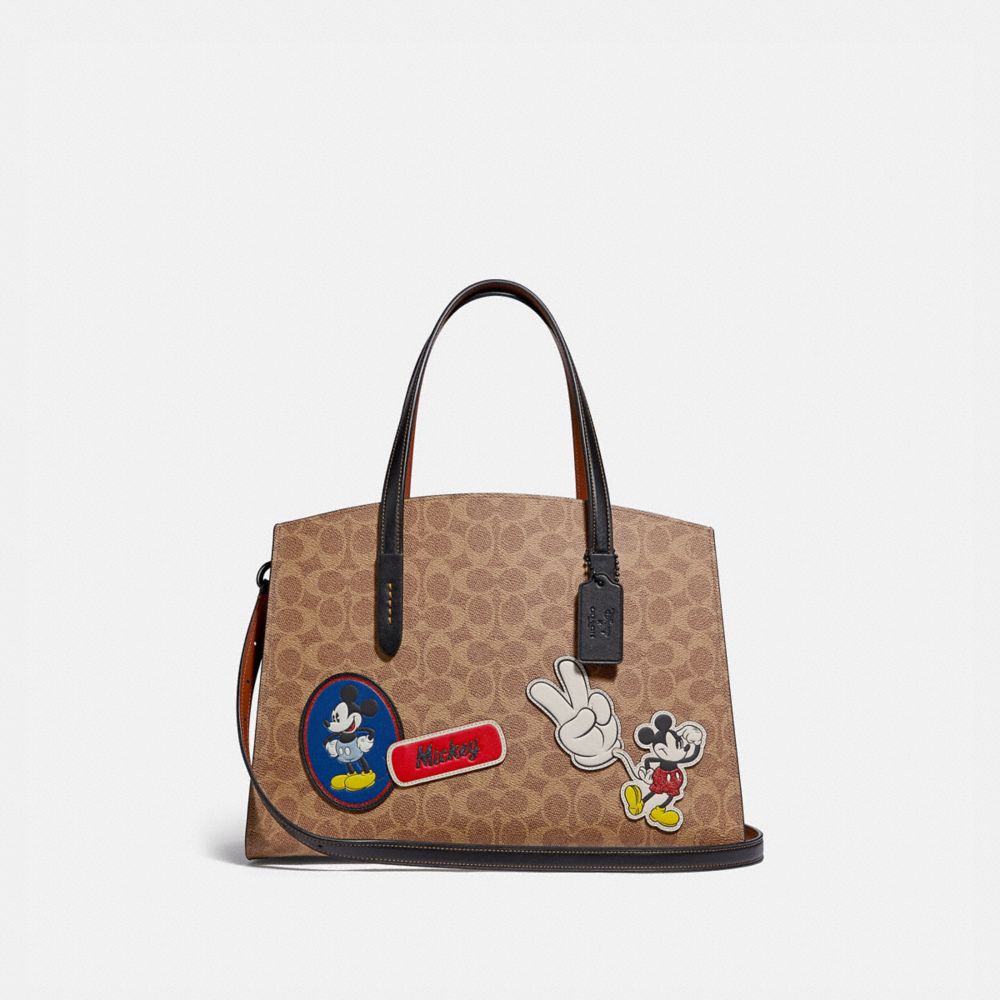 COACH® | Disney X Coach Charlie Carryall In Signature Canvas With Patches
