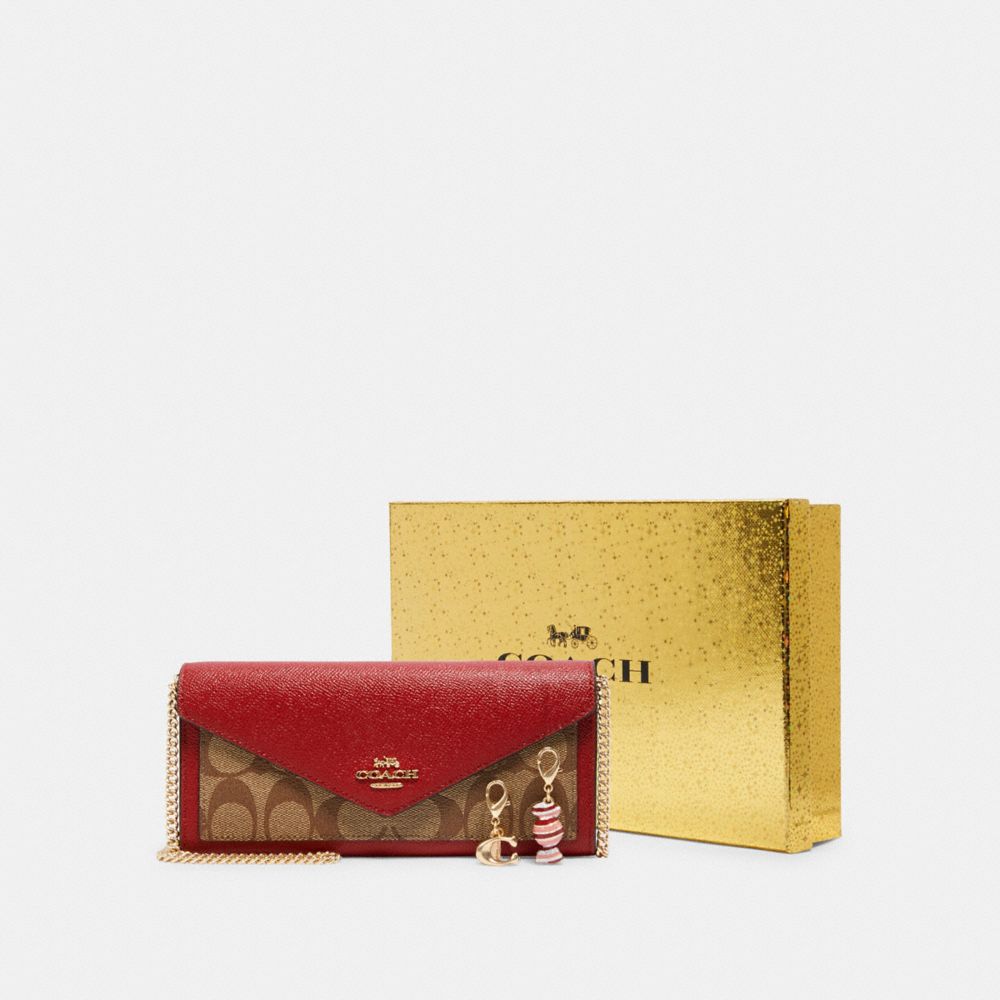 COACH® Outlet | Boxed Slim Envelope Wallet With Chain In Signature Canvas
