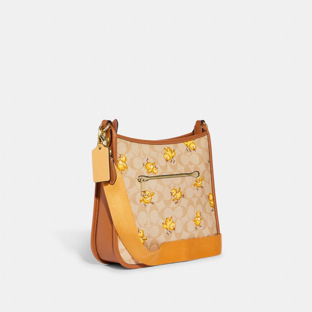 COACH® | Dempsey File Bag In Signature Canvas With Tossed Chick Print