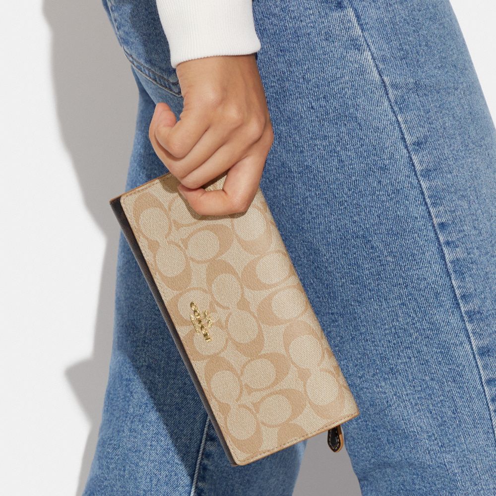 Teal Coach Signature Wallets